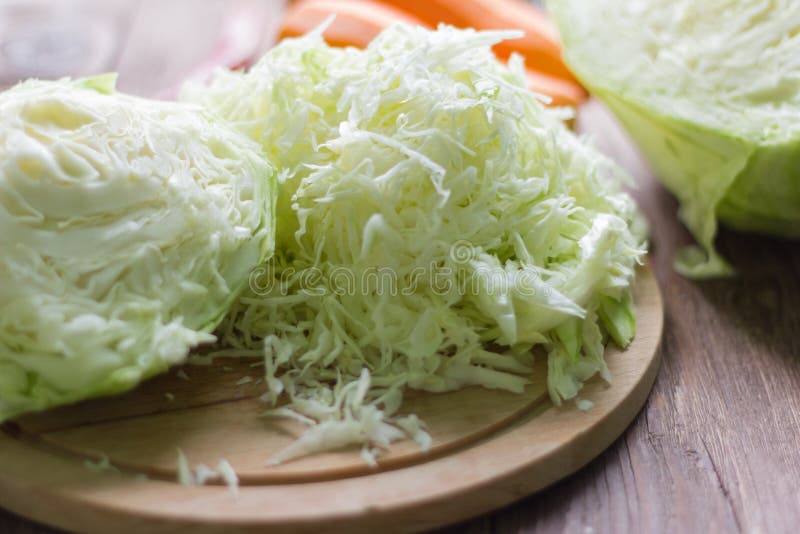 White Cabbage Cut into Strips and Carrots for Cooking Stock Photo ...