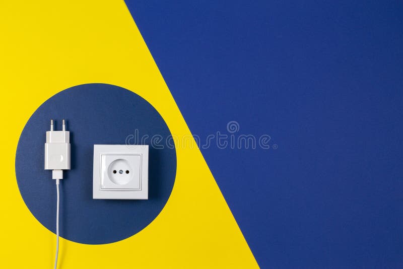White Cable and Electrical Socket on Yellow Blue Navy Color Background ...