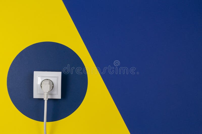 White Cable Plugged into Electrical Socket on Geometric Yellow Blue ...