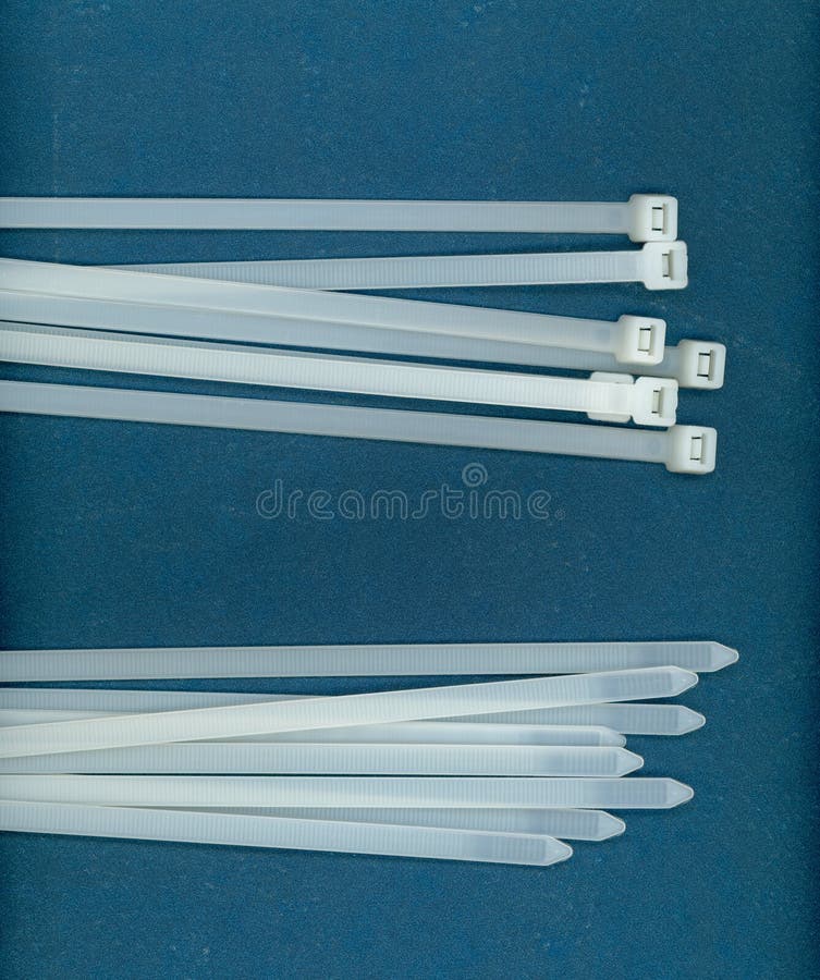 White Cable Tie (aka Hose Ties or Zip Ties Stock Image - Image of white ...