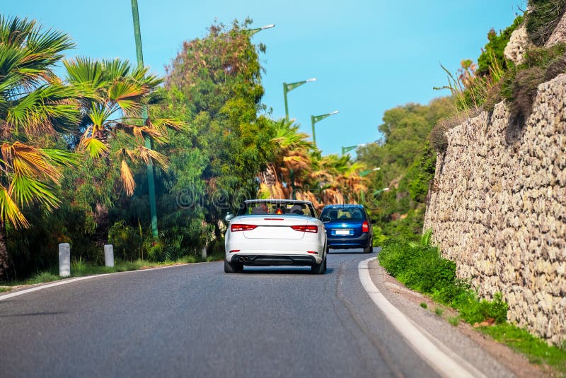 White Cabrio Car is Driving Along the Road. Stock Image - Image of rent ...