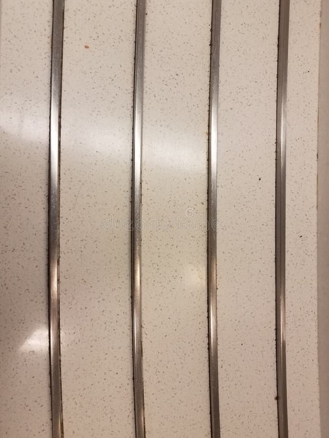 White Cafeteria Counter with Metal Grooves or Tracks Stock Photo ...