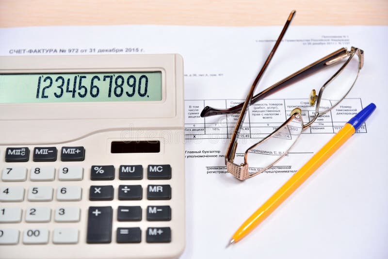 White Calculator, Yellow Handle with the Glasses and Invoice are Stock ...