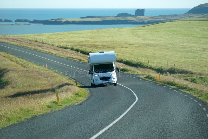 White Camper Driving on a Road - Front View Stock Photo - Image of view ...