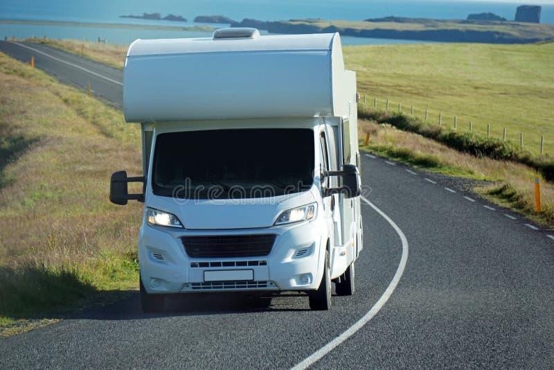 White Camper Driving on a Road - Front View Editorial Stock Photo ...