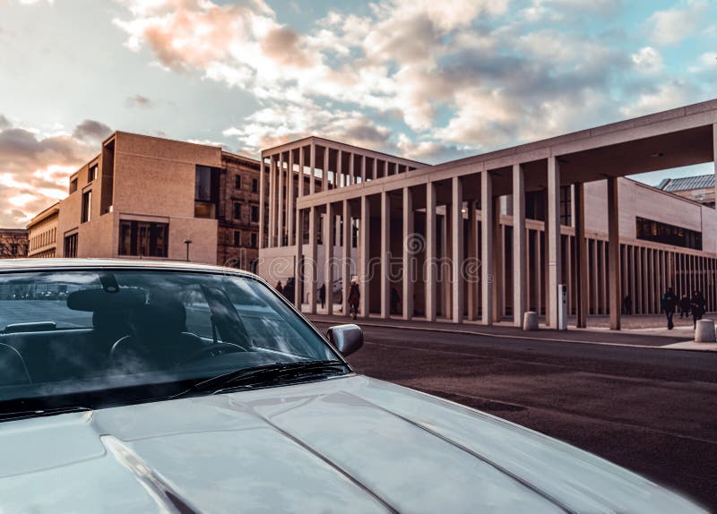 White Car with a Building and Sunset Background Stock Photo - Image of ...