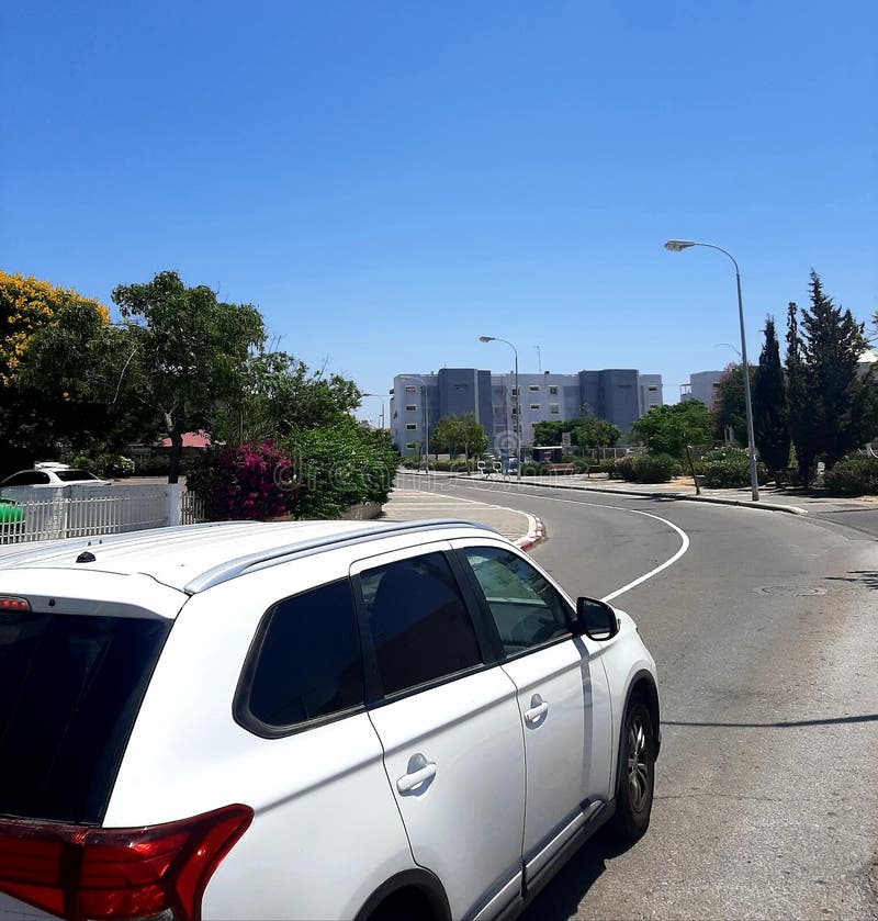 A White Car Driving on a Left Curve Stock Photo - Image of white ...
