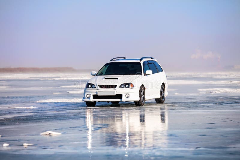 Red Car Moving by Ice of Frozen River Stock Photo - Image of frost ...