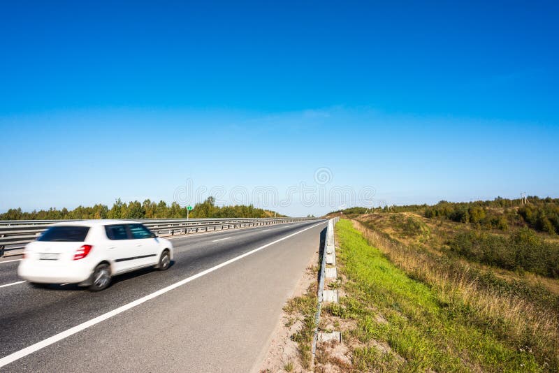 White car on rural road stock image. Image of activity - 85491067