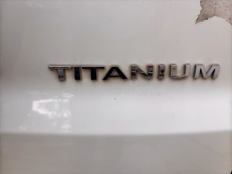 A White Car with the Word "Titanium" on the Back Stock Photo - Image of logotype, abstract ...