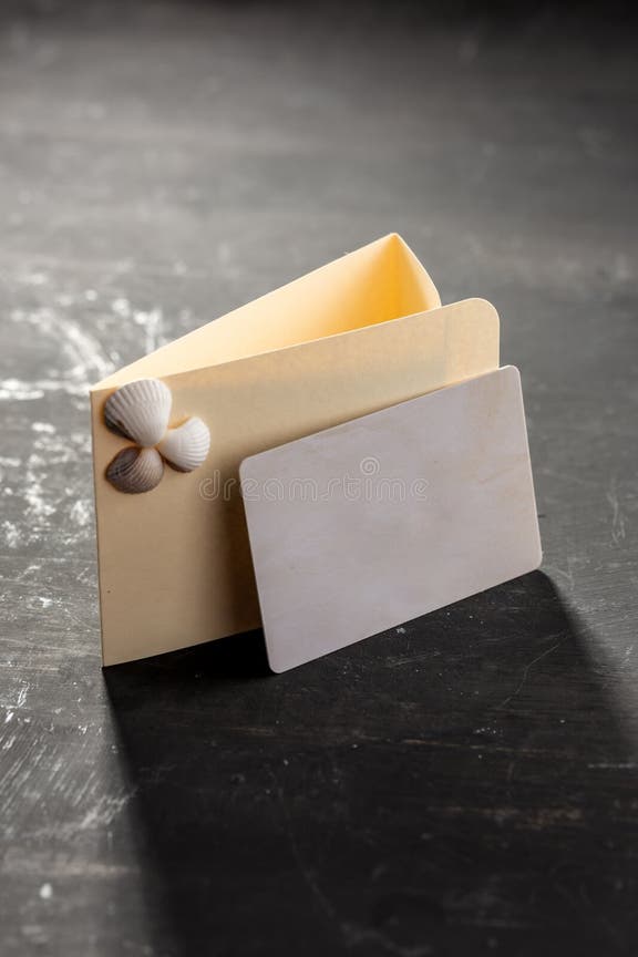 White Card and Envelope with Seashell on Black Background Stock Photo ...