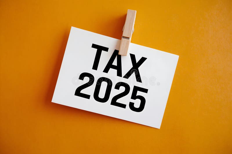 A White Card Pinned with TAX 2025 Against an Orange Background Stock ...