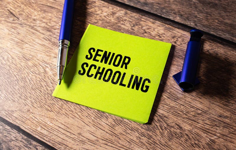 White Card with the Text Senior Schooling on Study Desk Stock Photo ...