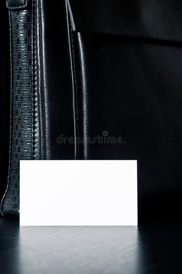 White Card for Writing with Black Leather Bag on the Table Stock Photo ...