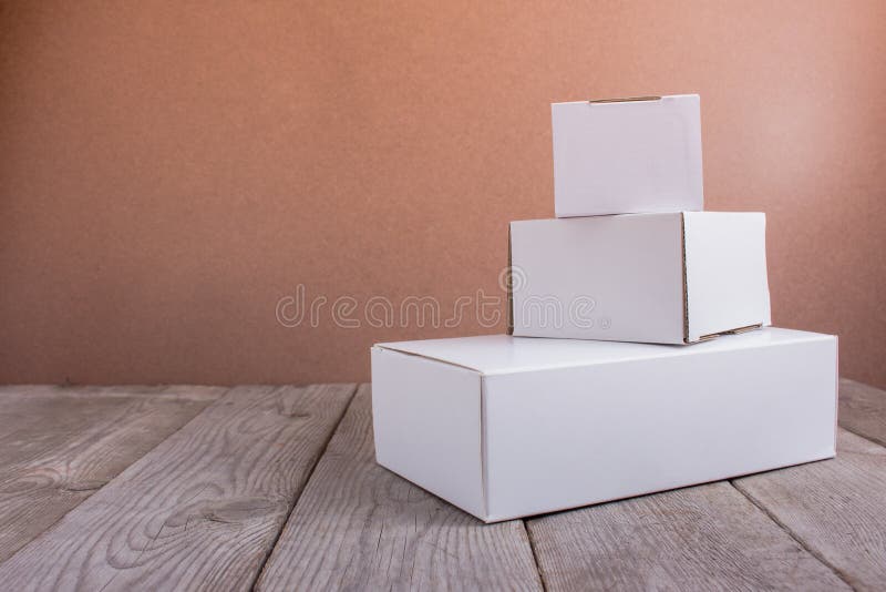 White Cardboard Boxes on Wood Background Stock Photo - Image of retro ...