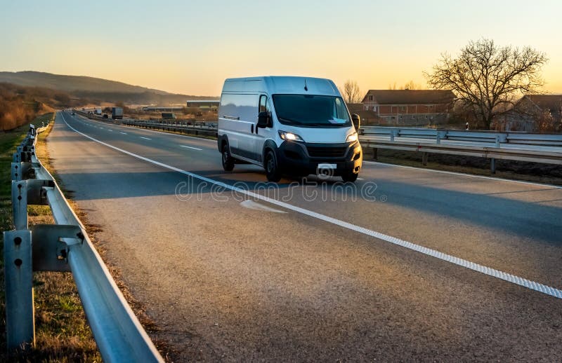 White cargo van on Highway stock photo. Image of modern - 341630084