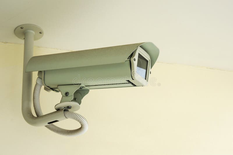 White CCTV Security Camera on Ceiling Background ,Closed-circuit ...