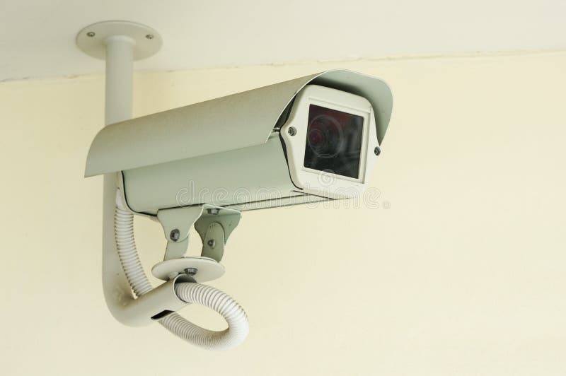 White CCTV Security Camera on Ceiling Background ,Closed-circuit ...