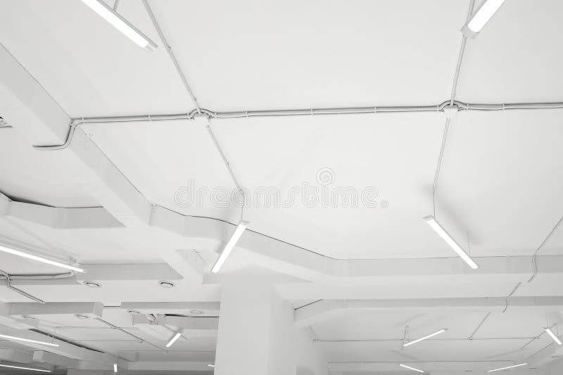 White Ceiling with Modern Lighting in Room, Low Angle View Stock Photo ...