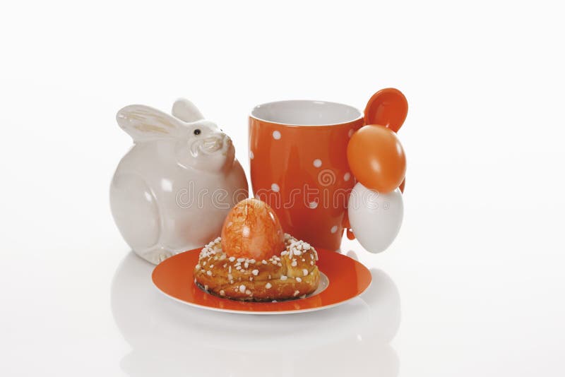 White Ceramic Bunny Jug with Coffee Cup, Pastry and Easter Eggs Stock ...