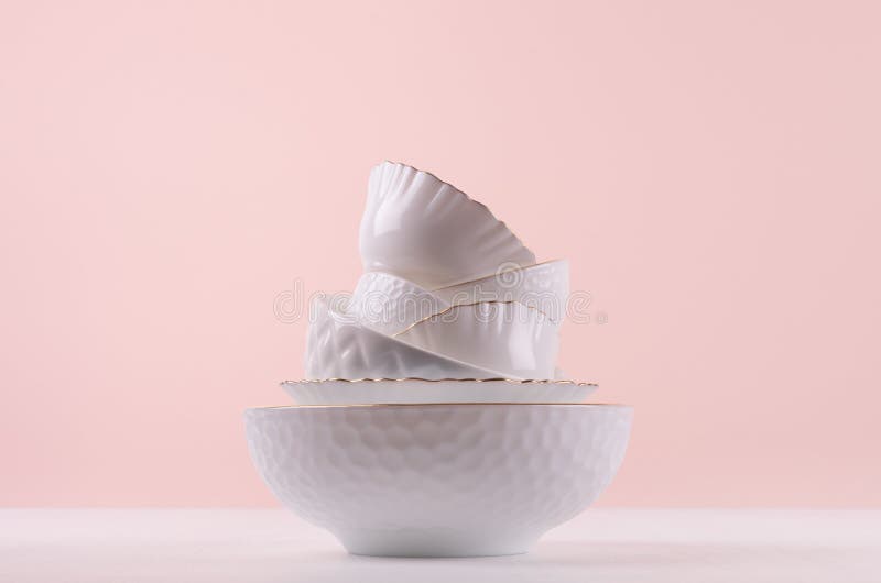 White Ceramic Crockery Stack with Golden Bezel, Different Texture on ...