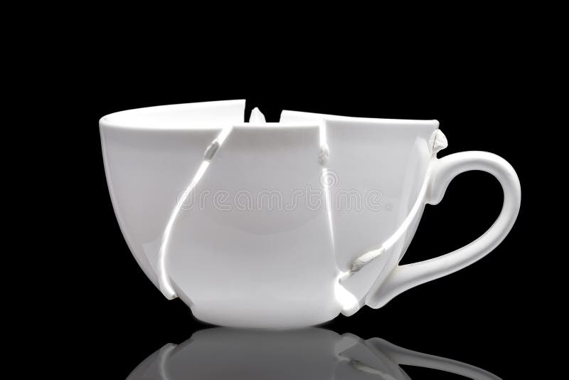 White Ceramic Cup Broken into Fragments As a Result of the Fall and ...