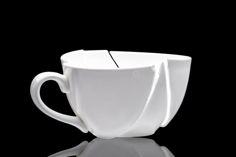 White Ceramic Cup Broken into Fragments As a Result of the Fall and ...