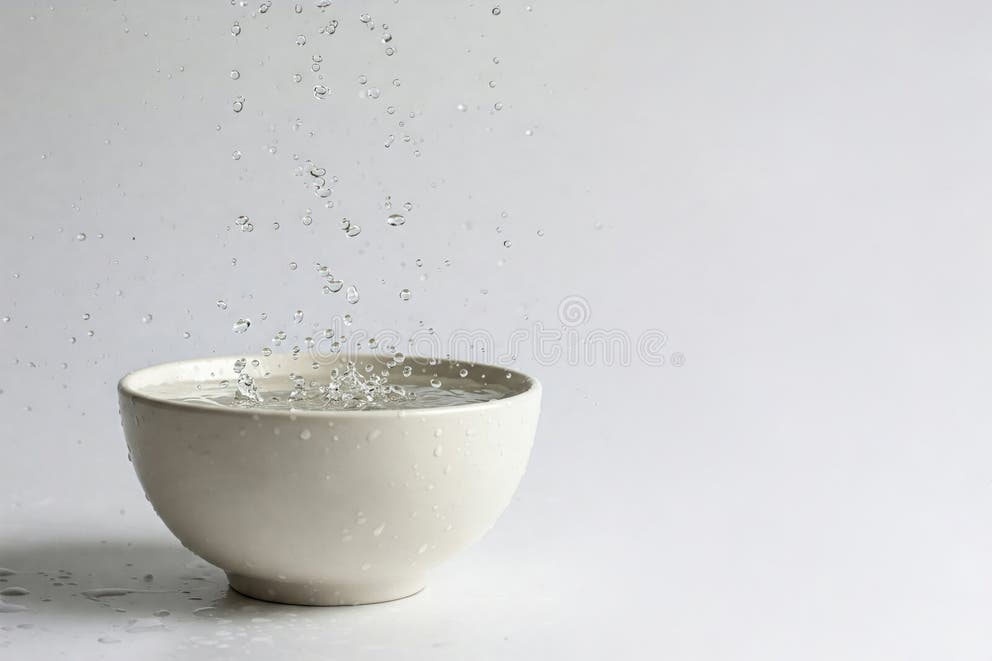 The White Ceramic Cup is Overflowing with Water Droplets. Space for ...