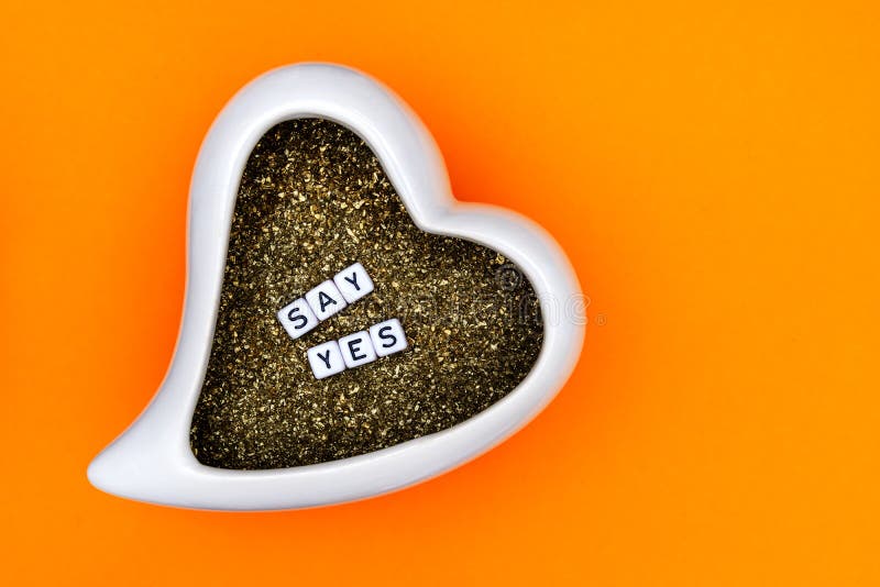 A White Ceramic Heart with the Text SAY YES Stock Photo - Image of ...