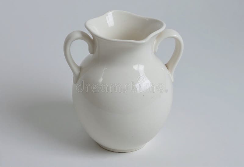 Elegant White Ceramic Vase with Dual Handles on a Smooth, Reflective ...