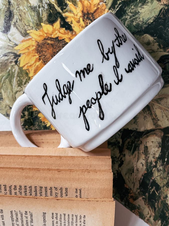 A Mug on a Pile of Books, with Writing in Cursive Writing Stock Photo ...