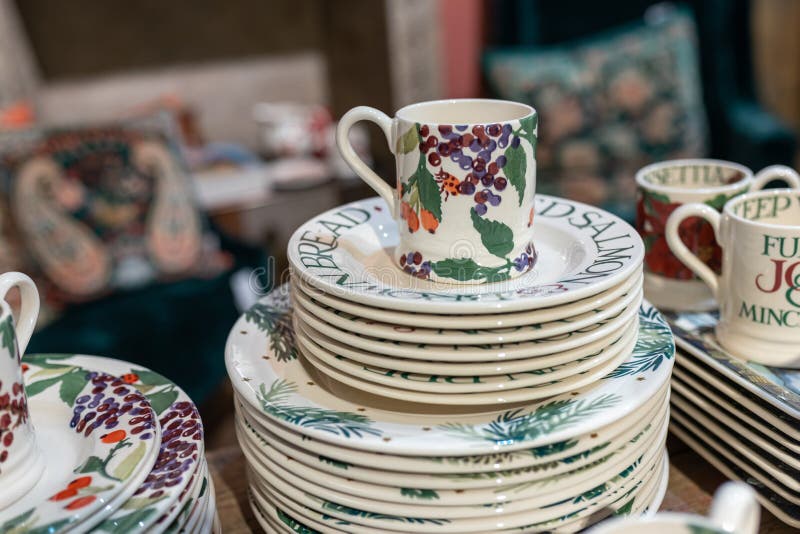White Ceramic Plates on a Shelf in Store. Designer Ceramic Plates with ...