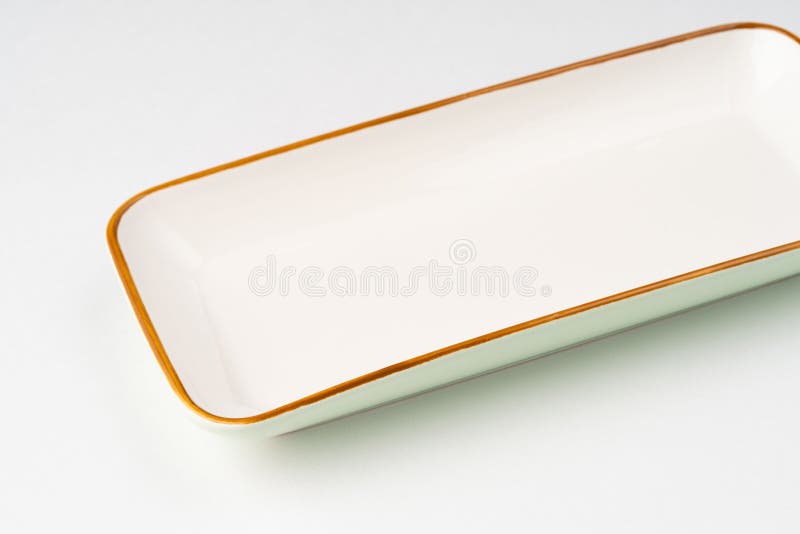 White Ceramic Rectangular Serving Tray with an Orange Outline Stock ...