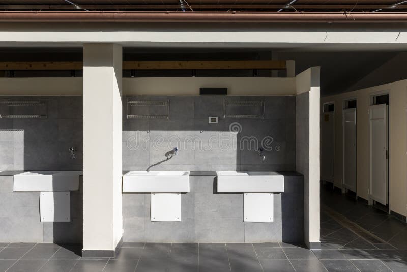 White Ceramic Sink for Washing Clothes Under a Canopy in a Campsite ...