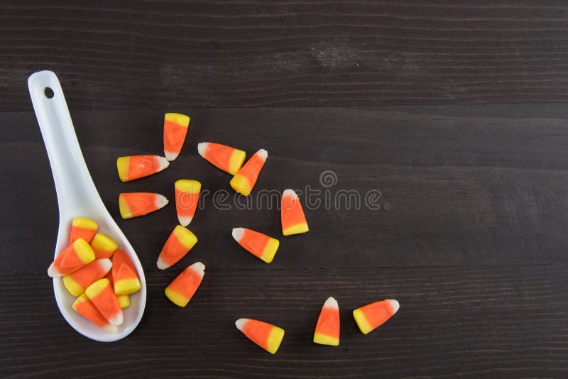 White Ceramic Spoon Full of Candy Corn Stock Photo - Image of looking ...