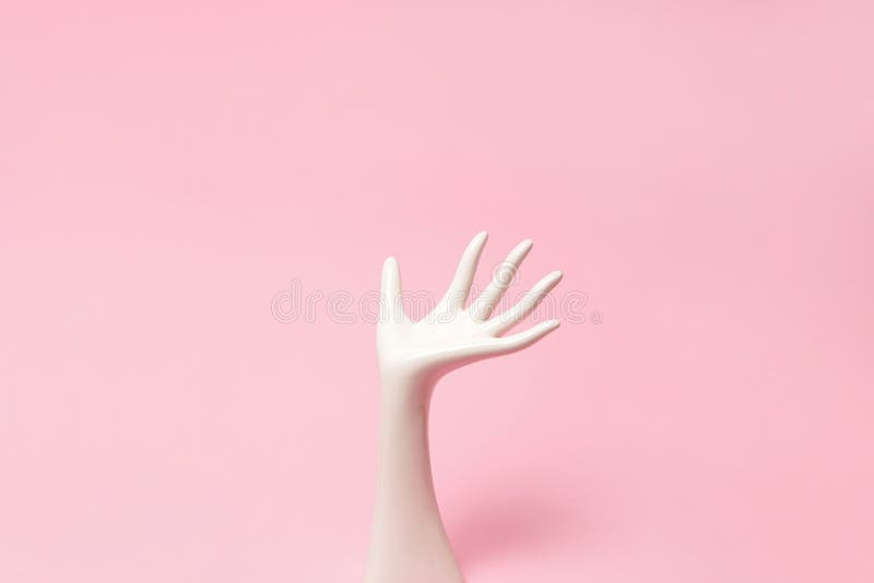 White Ceramic Statue Hand on Pink Background with Copy Space Stock ...