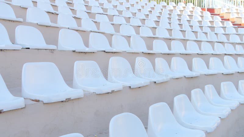 White Chairs of an Empty Amphitheater or Stadium Under the Open Sky. a ...