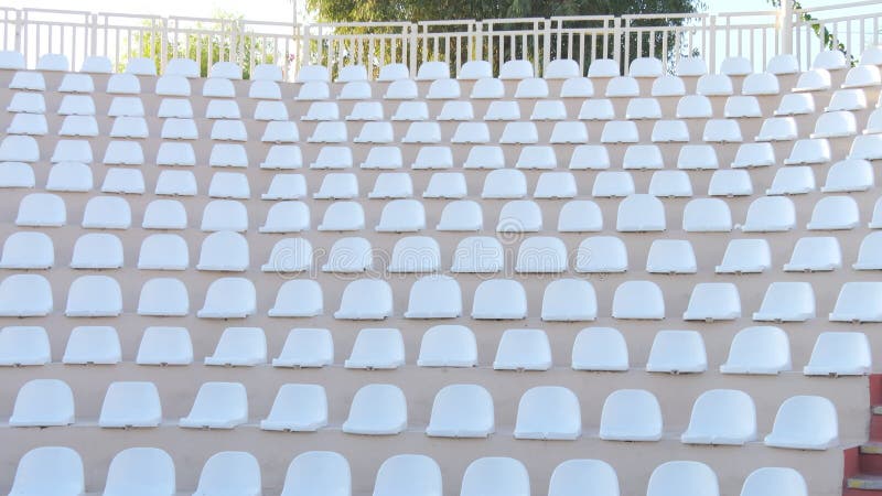 White Chairs of an Empty Amphitheater or Stadium Under the Open Sky. a ...