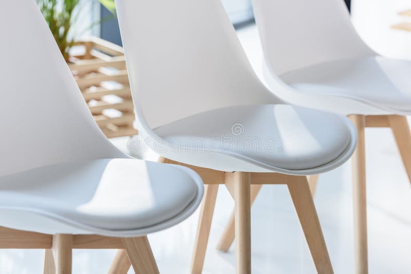 White chairs in light stock image. Image of business - 120685227