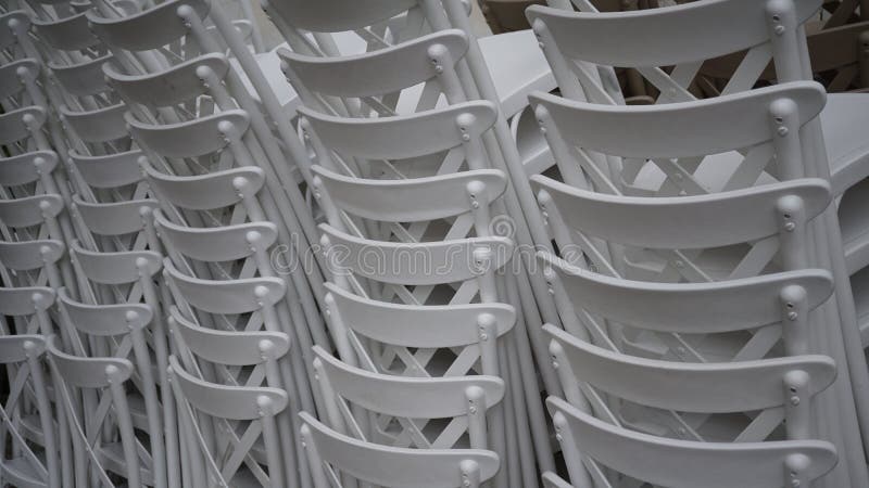 Stacked white chairs stock image. Image of nature, color - 108661199