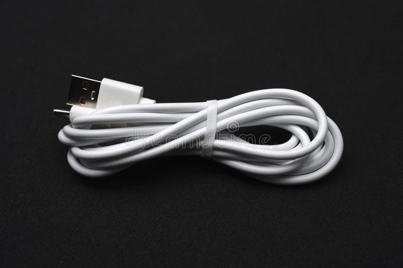 White Charging Cable on a Black Background. USB Cable Stock Image ...