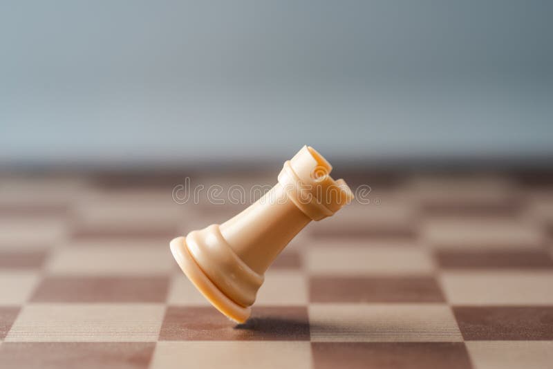 White Chess Castle Falling On Chess Board Concept Of Failing Stock ...