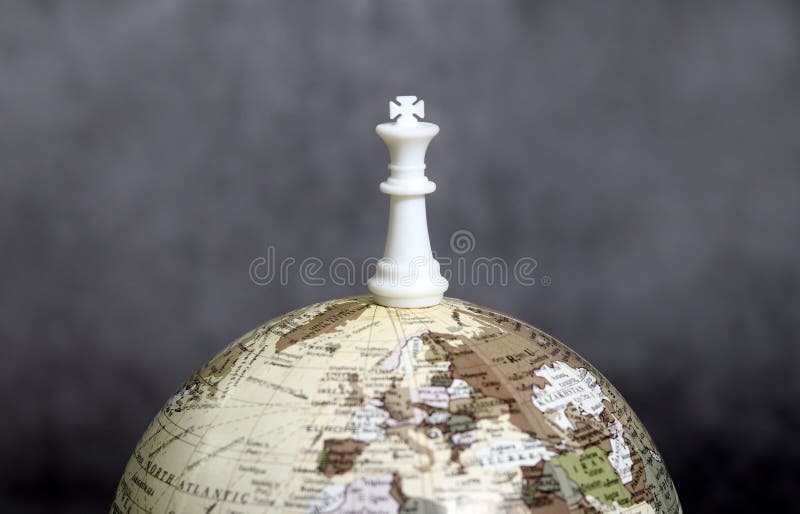 White chess king on earth. stock image. Image of globe - 322565183