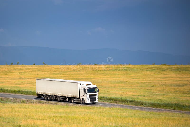 White Chinese Truck on a Road Moving in a Field Stock Image - Image of ...