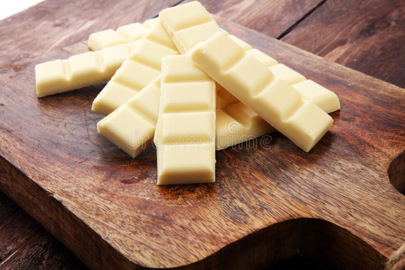 White Chocolate Bars and White Choco Pieces on Wood Stock Photo - Image ...