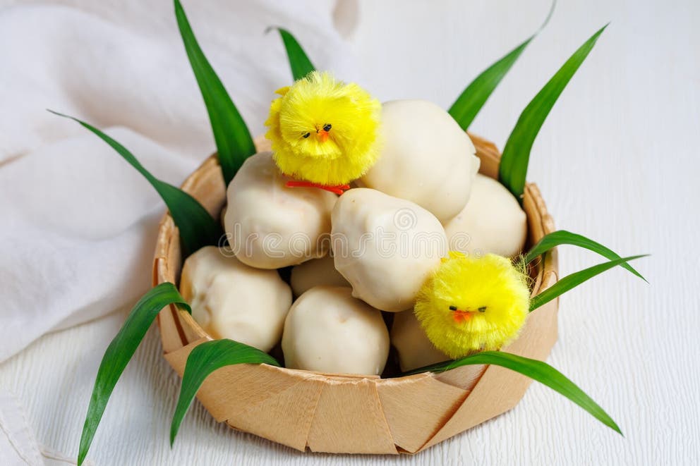 White Chocolate Easter Eggs. Sweet Candy Eggs in Nest on White Table ...