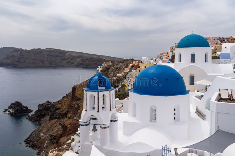 White Churches with Blue Domes in Oia Overlooking the Sea Stock Photo ...