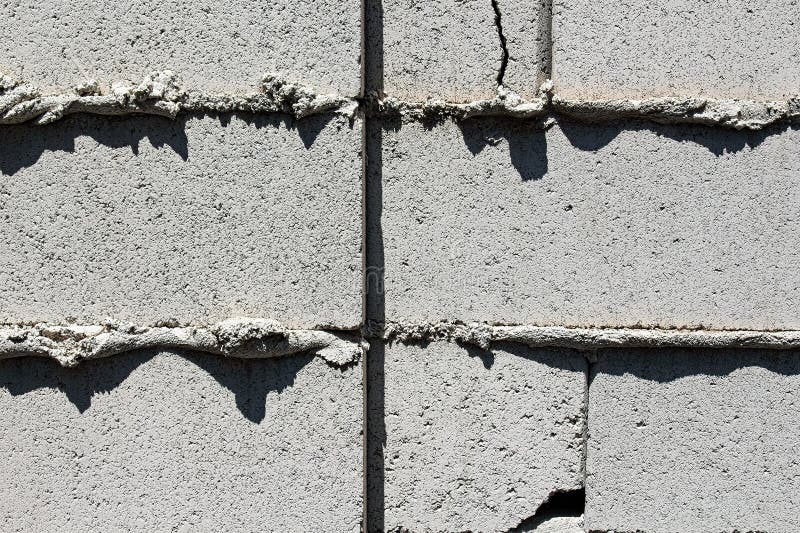 White Cinder Block Wall with Oozing Concrete, and Cracks on the Blocks ...