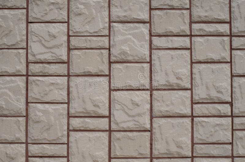 White Cladding Tiles Imitating Stone with Red Joints on Wall Close ...
