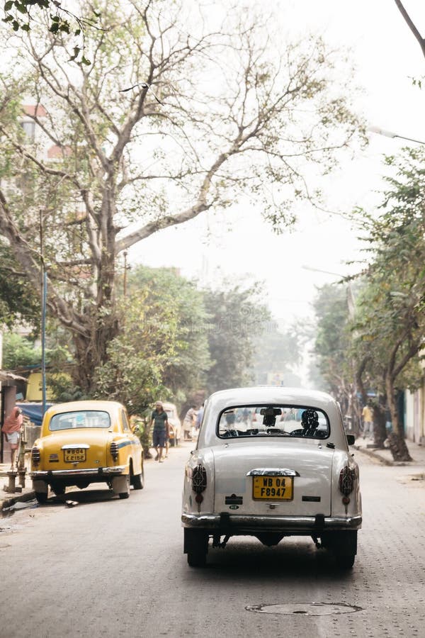 White Classic Car Run on the Street with Trees in Kolkata, India ...